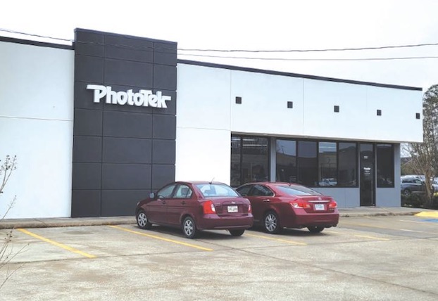 PhotoTek reopens: Post-hurricane color scheme pays homage to ...